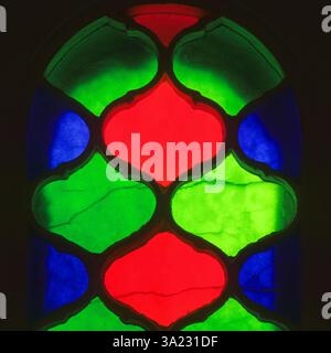 Close detail of geometric Yemeni stained glass in red, green, blue ...