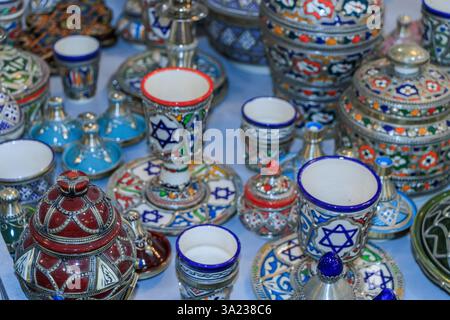 Craftsman painting and decorating ceramic products in pottery factory ...