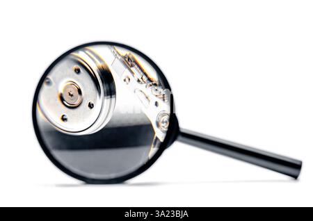 Hard disk drive under magnifying glass on white backdrop Stock Photo ...