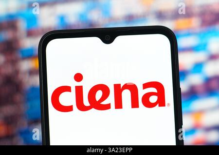 In this photo illustration the Ciena logo is seen on a smartphone and a ...