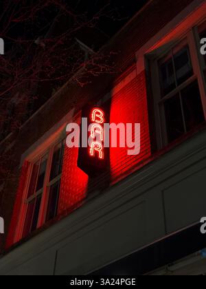 Neon red bar sign on building exterior at night, New York City, New ...