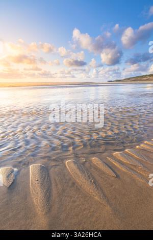 The beach at Hargen aan Zee at low tide with a beautiful sunset. The ...