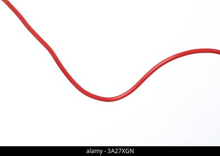 One red electrical wire on white background Stock Photo - Alamy