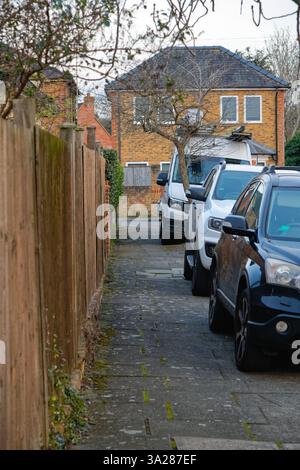 A car parked on a pavement, causing an obstruction for pedestrians ...