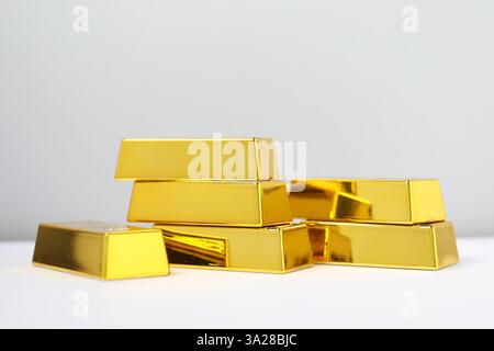 Many shiny gold bars on white background Stock Photo - Alamy