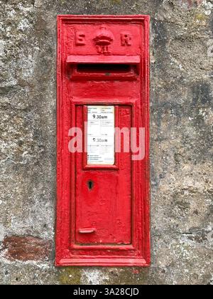 An Edward VII postbox in a stone wall Stock Photo - Alamy