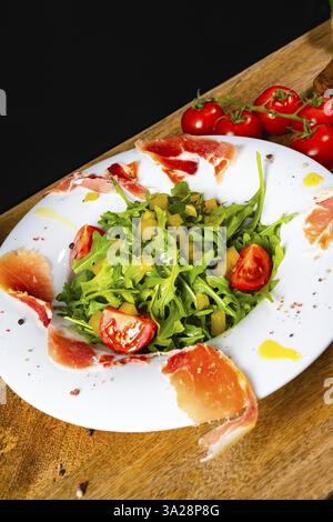 Rocket salad with dried Spanish ham Stock Photo - Alamy