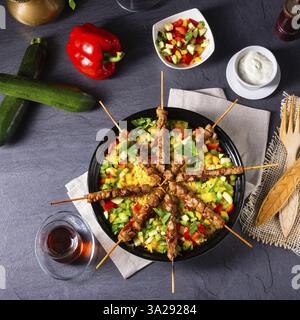 Lamb kebabs with curry rice and various vegetables Stock Photo - Alamy