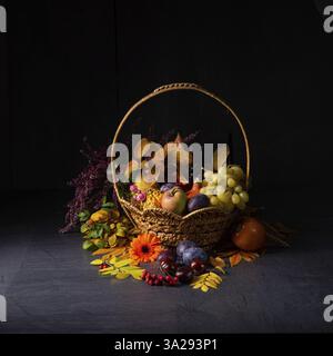 Autumn cornucopia in a round basket Stock Photo - Alamy