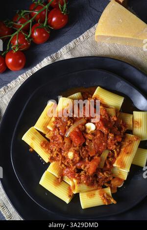 Freshly cooked dish of tasty pasta with tomato sauce and parmesan ...