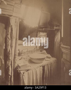This photograph by Eugène Atget shows the interior of a workwoman’s ...