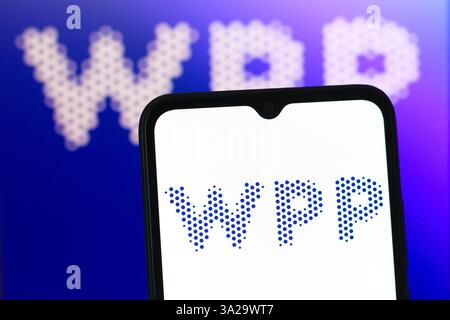 In this photo illustration, the WPP Group logo is seen displayed on a ...