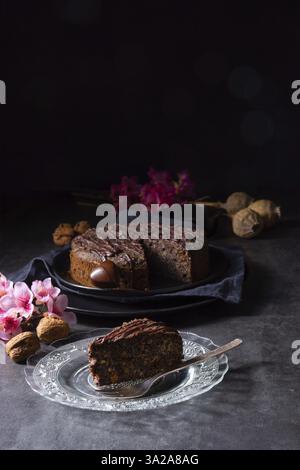 Juicy poppy seed cake with apples and chocolate icing Stock Photo - Alamy