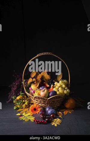 Autumn cornucopia in a round basket Stock Photo - Alamy