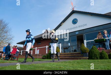 Jockeys Mr Huw Edwards and Mr Tommie O' leave the weighing room at Bangor-On-Dee Racecourse ...