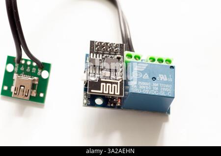 Closeup of an IOT (Internet of Things) module holding hands. This ...