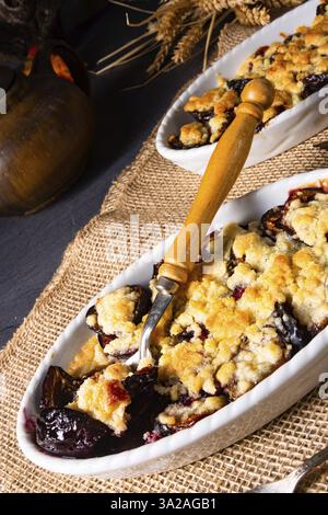 Cinnamon plums with crumble Stock Photo - Alamy