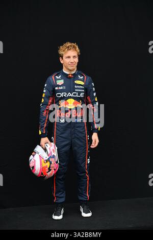 Liam Lawson of New Zealand and Racing Bulls play curling prior to the ...