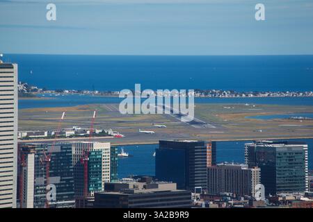 The Logan International Airport and office tower buildings in Boston ...