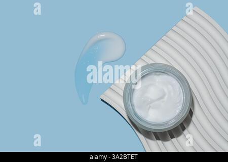 Moisturizing cream in frosted glass jar packaging on cocnrete tray on ...