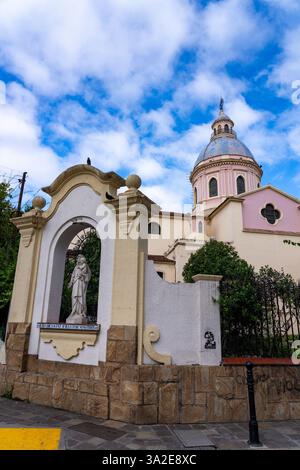 A statue of Mary and the dome of the Cathedral of Salta in Salta ...