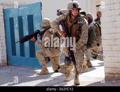 Marines from 2nd Battalion, 4th Marine Regiment, flee mortar rounds ...