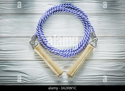 Skipping rope with wooden handles on green surface sports training ...