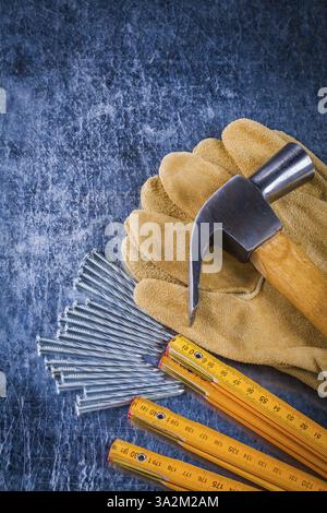 Leather protective construction gloves nails and claw hammer on ...