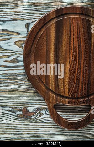 Round carving board on wood background Stock Photo - Alamy
