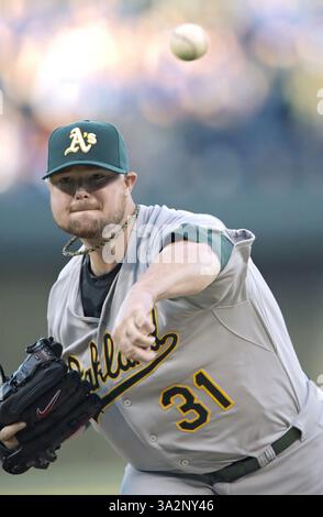 Oakland Athletics starting pitcher Jon Lester throws during the first ...