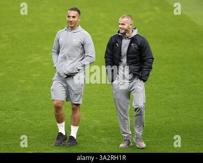 Derby County's Kane Wilson (left) and Stoke City's Lynden Goochbattle ...