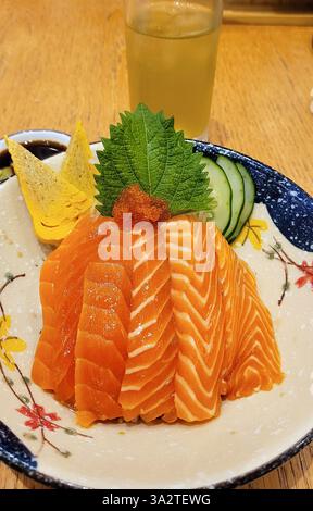 Fresh raw salmon sashimi slices in plastic box ready for take away ...