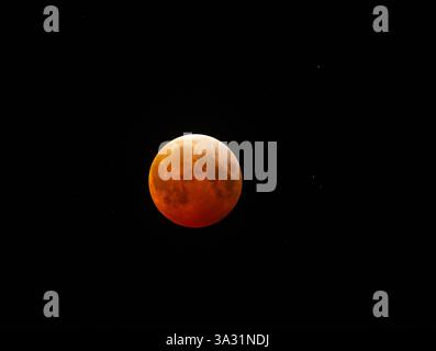 Toronto, Canada. 14th Mar, 2025. The moon is seen during a total lunar ...