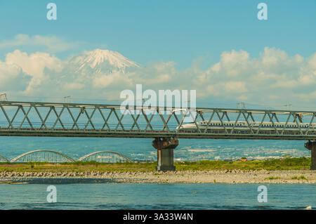 Mount Fuji and the Fuji River (or Fujikawa) seen from a train on the ...