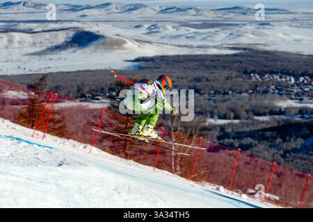 ski racer soars through air during competitive downhill skiing Stock ...