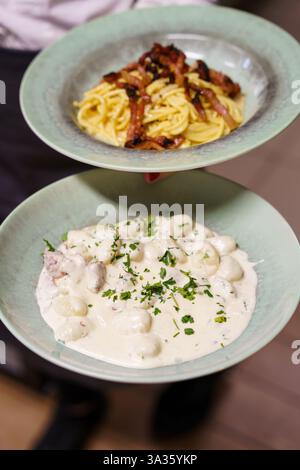 Delicious plate of spaghetti carbonara topped with crispy bacon and ...