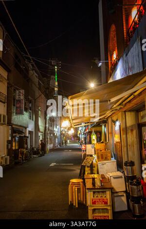 Rokku Broadway at night in Asakusa, Tokyo, Japan. It is famous as one ...