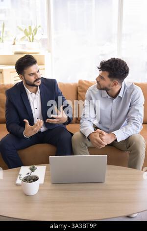 Businessmen engaged in serious discussion Stock Photo - Alamy