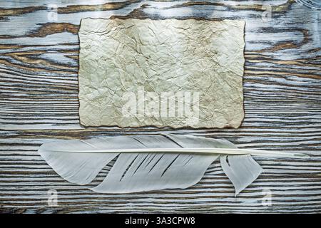 Vintage sheet of paper quill on wooden board Stock Photo - Alamy