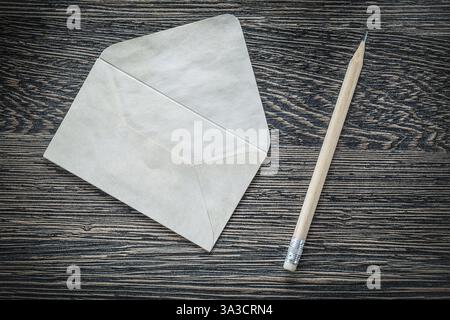 Vintage envelope pencil on black board top view Stock Photo - Alamy