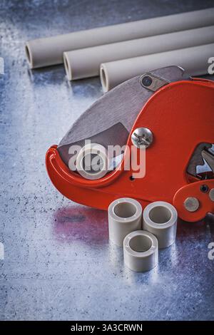 Pvc water pipe cutter on metallic background top view construction ...