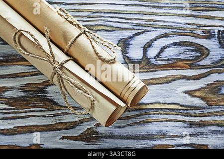 Vintage paper scrolls on wooden board Stock Photo - Alamy