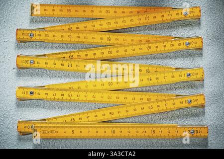 Wooden meter on concrete surface horizontal image construction concept ...