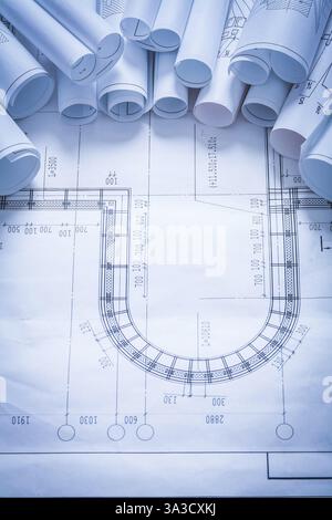 stack of rolled construction plans and technical drawings Stock Photo ...