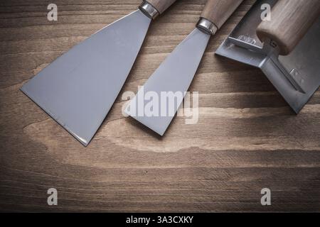 putty knife and two paint scrapers on vintage wood Stock Photo - Alamy