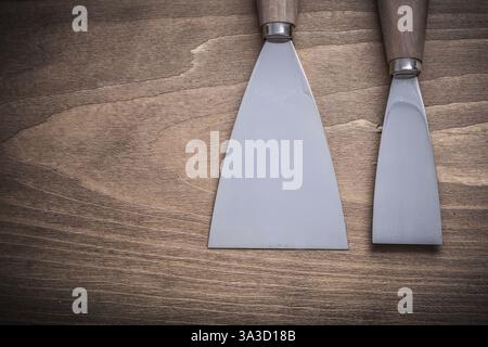 two paint scrapers with wooden handles Stock Photo - Alamy