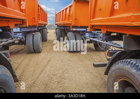 view through two rows of tippers Stock Photo - Alamy