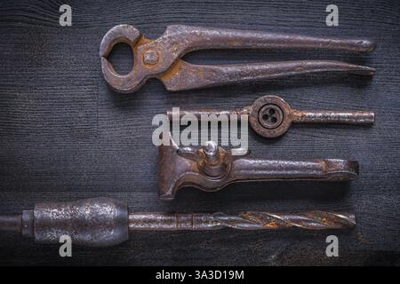 vintage rusted tools on dark board Stock Photo - Alamy