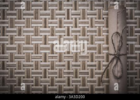 Vintage medieval rolled corded paper on woven wooden matting Stock ...