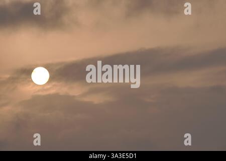 A sky, with diffused sun, clouds, colourful Stock Photo - Alamy